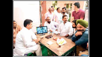 AAP's Sharma, Chander Mohan 'guard' EVMs at Panchkula government ...