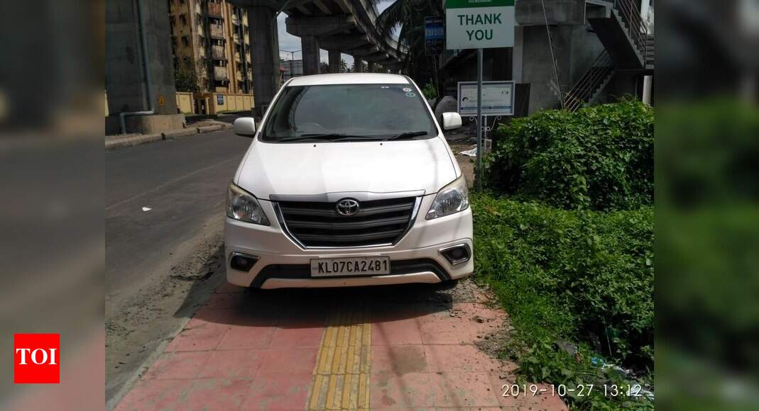 parking of car on the footpath - Times of India