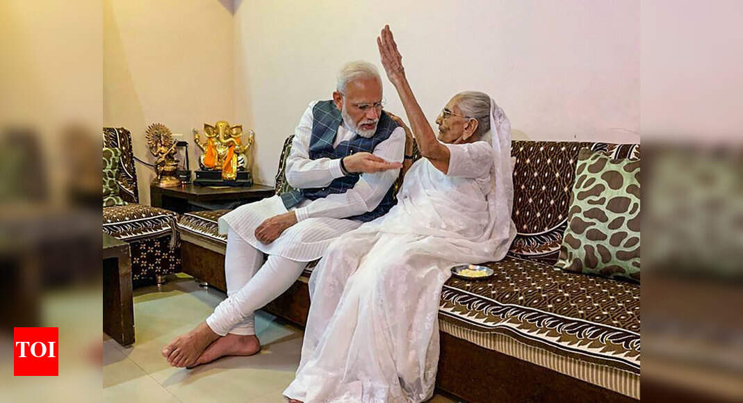PM Modi meets his mother in Gujarat | India News - Times of India