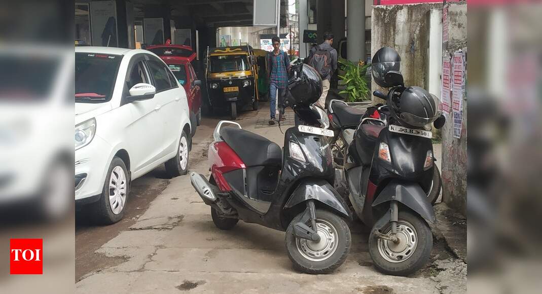 Vehicles parked in footpath - Times of India
