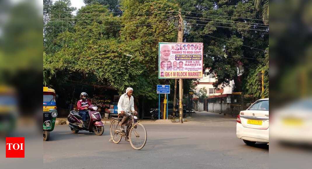 Hoarding hides traffic light - Times of India