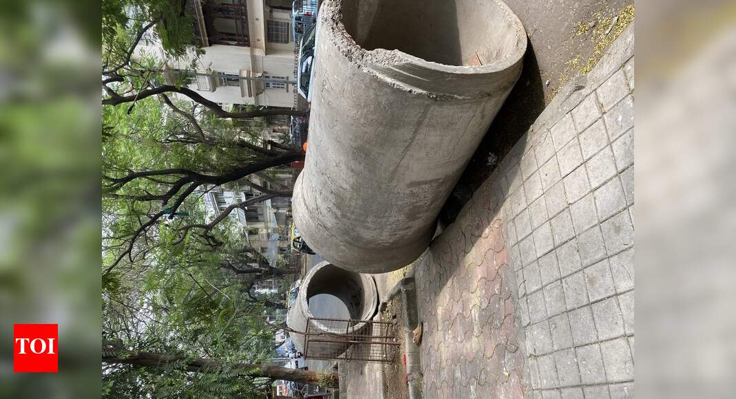 huge pipes blocking bus stop - Times of India