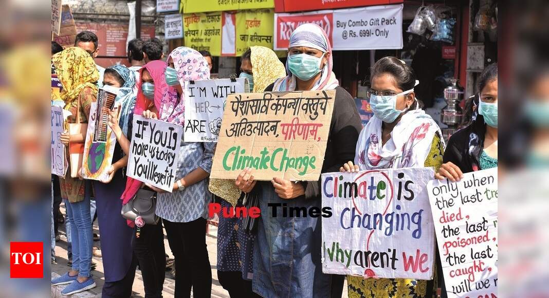 Songs, placards and a human chain – climate crisis protest grabs the ...