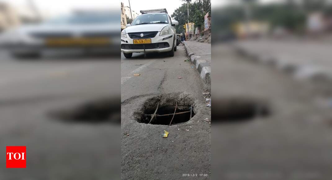 Caved-in main road - Times of India