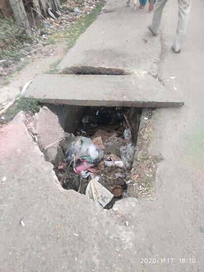Open drain in vasantapura main road - Times of India