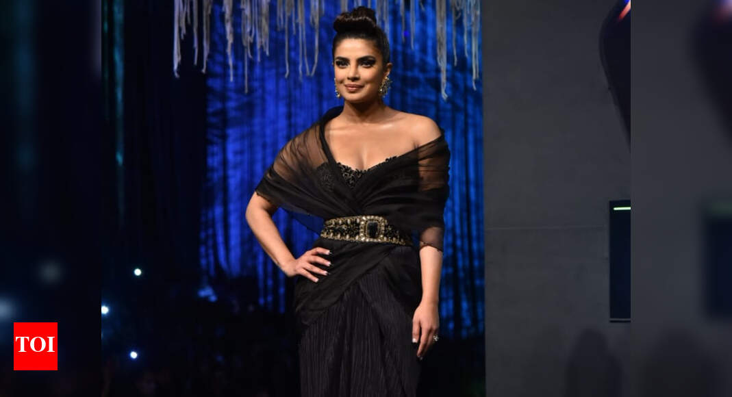 Video: Priyanka Chopra walks the ramp in a chic black ensemble; pays ...