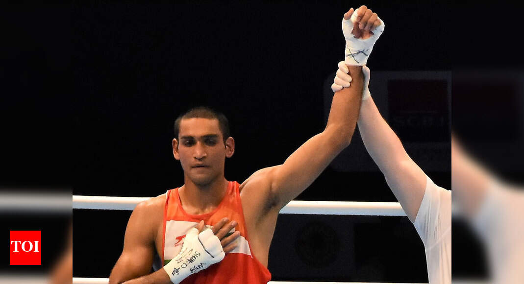 Ashish Kumar, Manish Kaushik enter quarters of boxing's Asian Olympic ...
