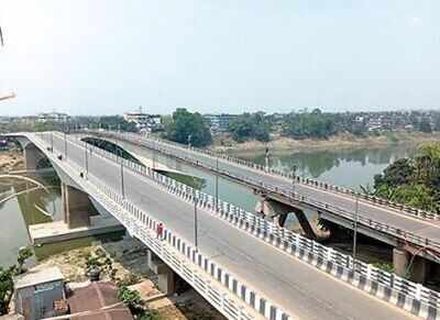 Assam: People out to get groceries maintain distance in Silchar ...