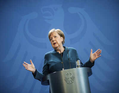 Germany's Angela Merkel returns to office after quarantine stint ...