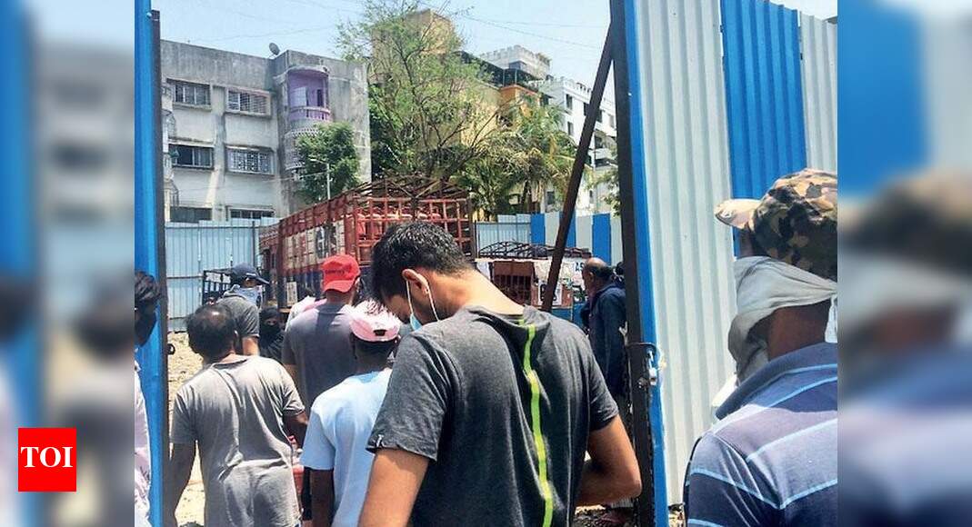 Pune: Social distancing takes backseat in serpentine queue at godown ...