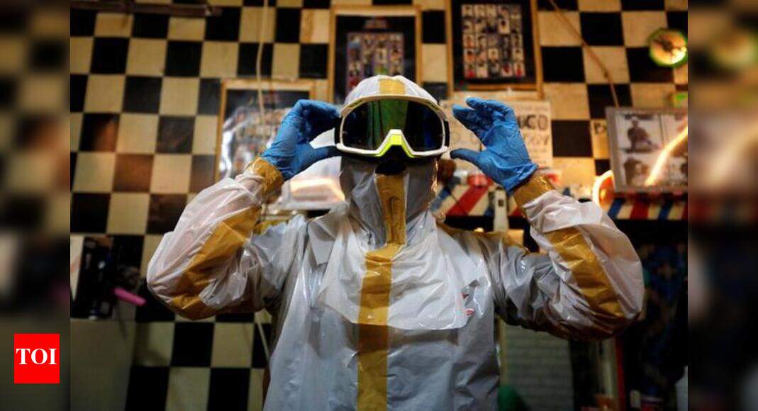 This barber is going viral for wearing makeshift protective gear to ...