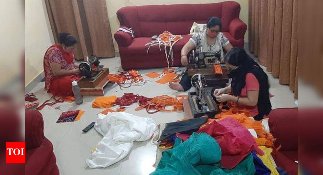 Community produces thousands of masks - Times of India