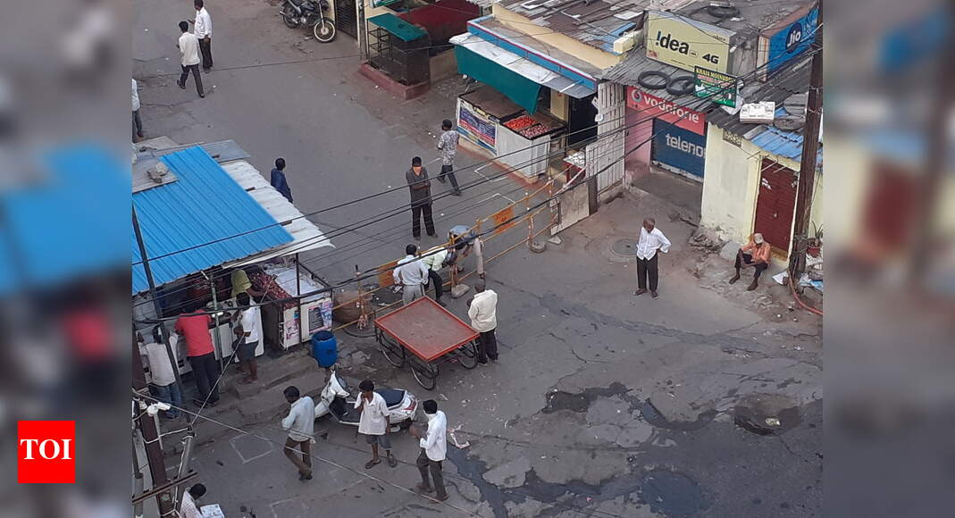 People Crossing Barricade - Times of India