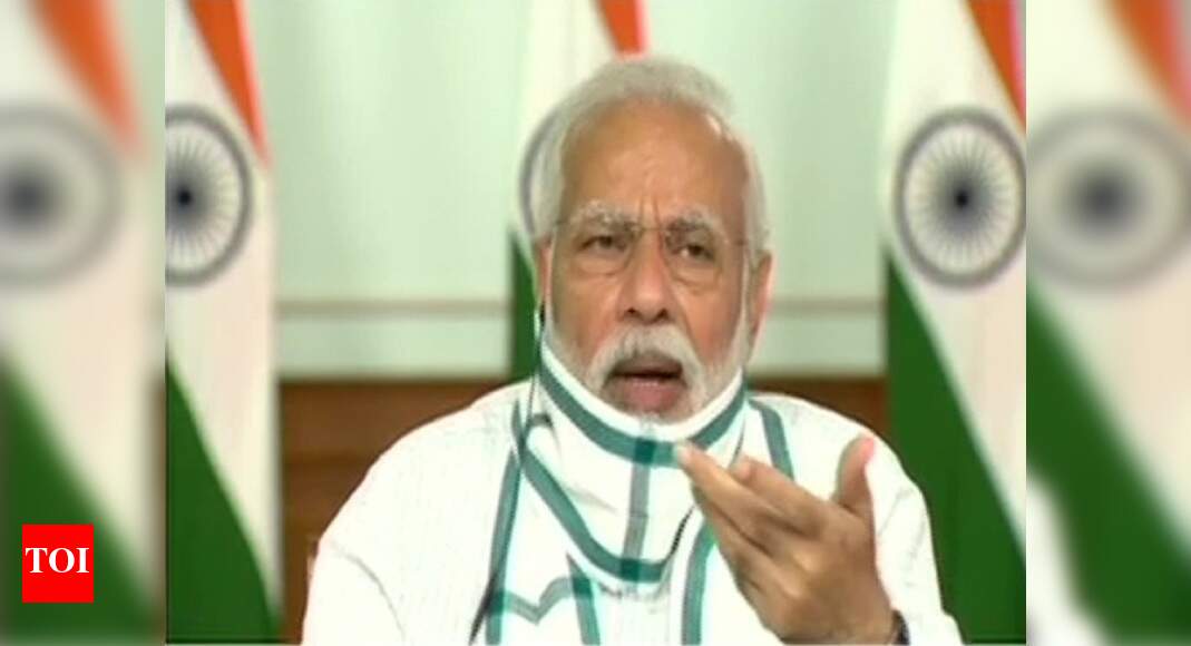 PM Modi sticks to trusted 'gamcha' mask | India News - Times of India