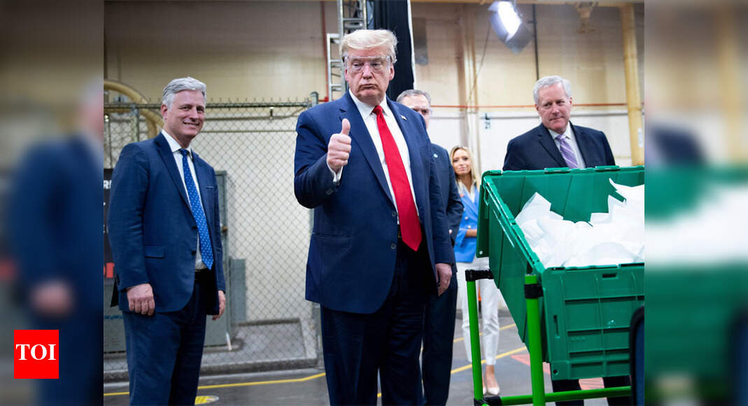 Trump visits masks factory but declines to wear one - Times of India