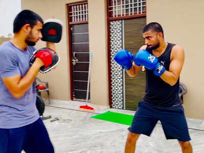 Olympic-bound boxer Manish Kaushik sparring at home with his brother ...