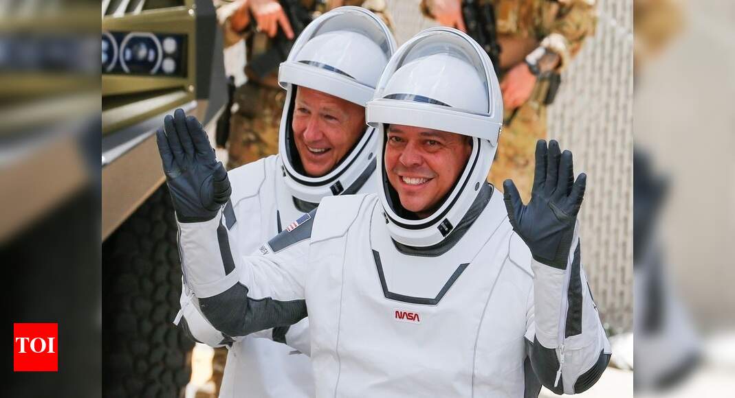 2 astronauts climb aboard SpaceX rocket for historic flight - Times of ...