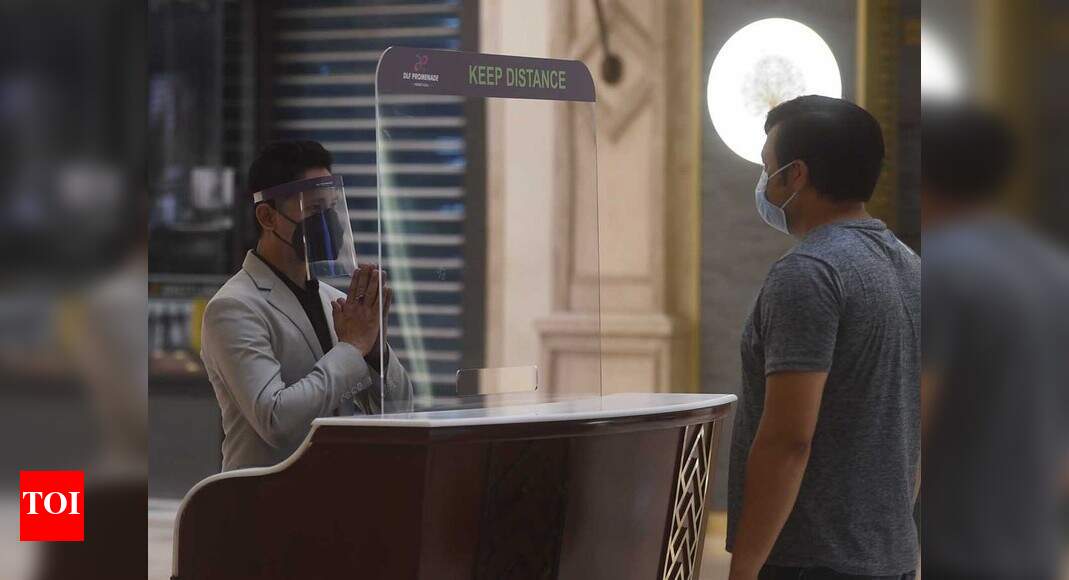 With isolation rooms, partition sheets and social distancing markers ...