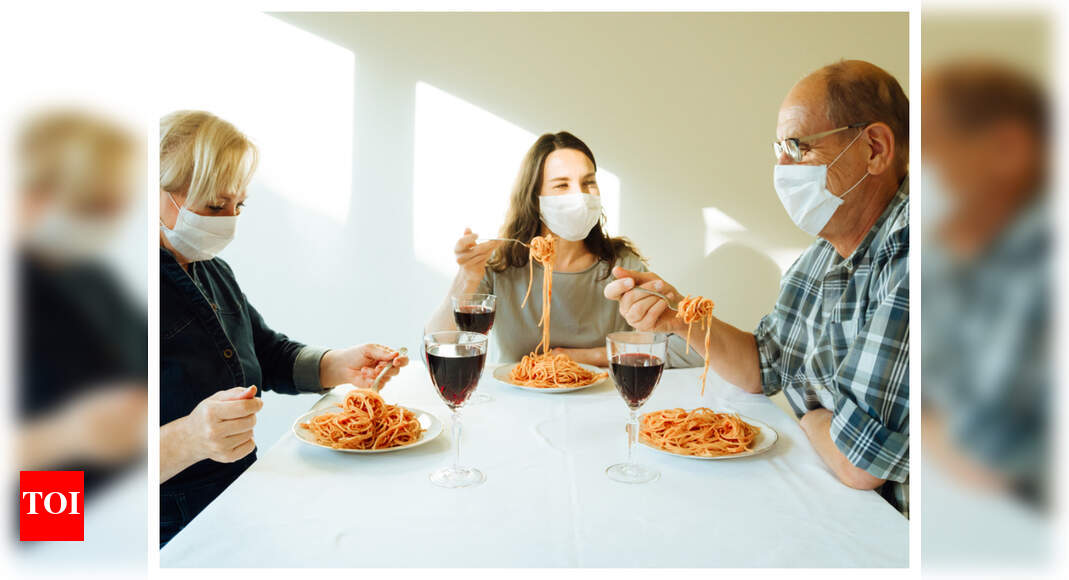 How to eat food while wearing a mask? - Times of India