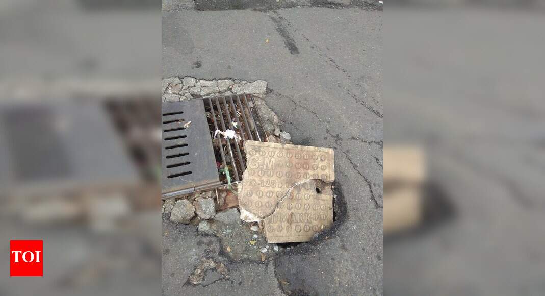 Broken drain cover guarded by plastic cover - Times of India