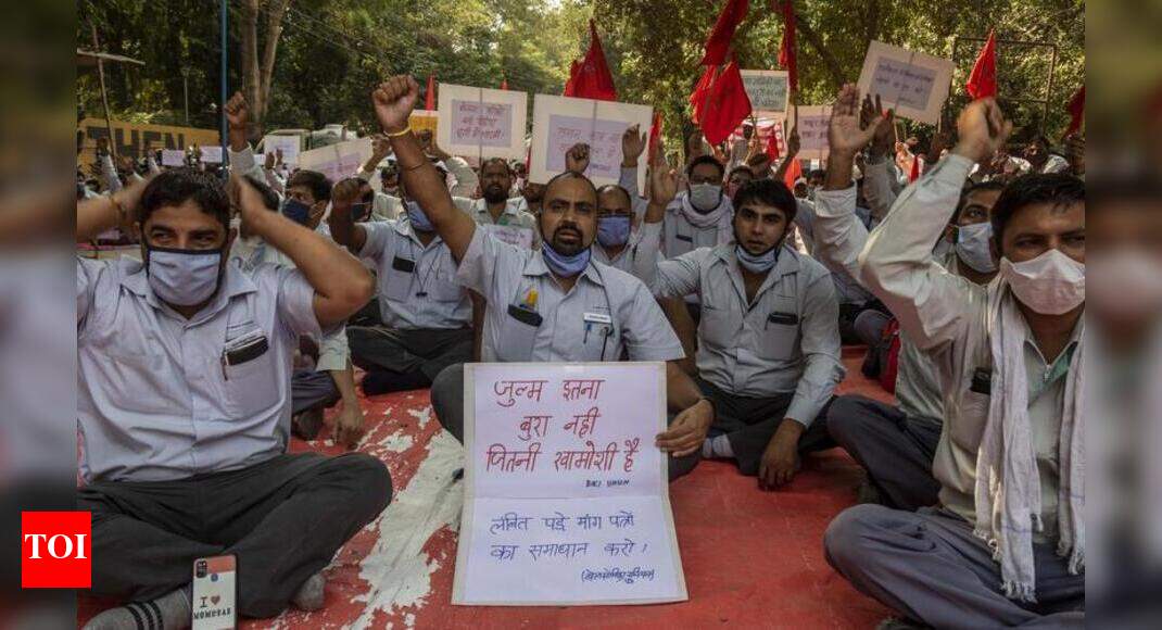 Industrial workers stage protest against pay cut, job loss | Gurgaon ...