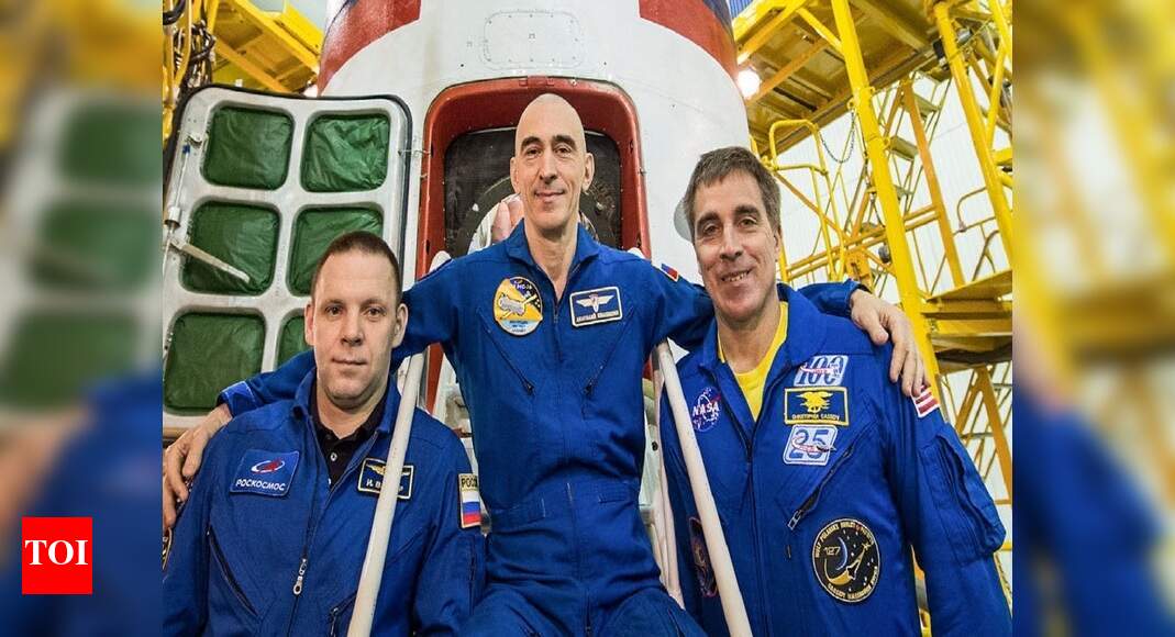 Three-man US-Russian crew returns to Earth from ISS - Times of India