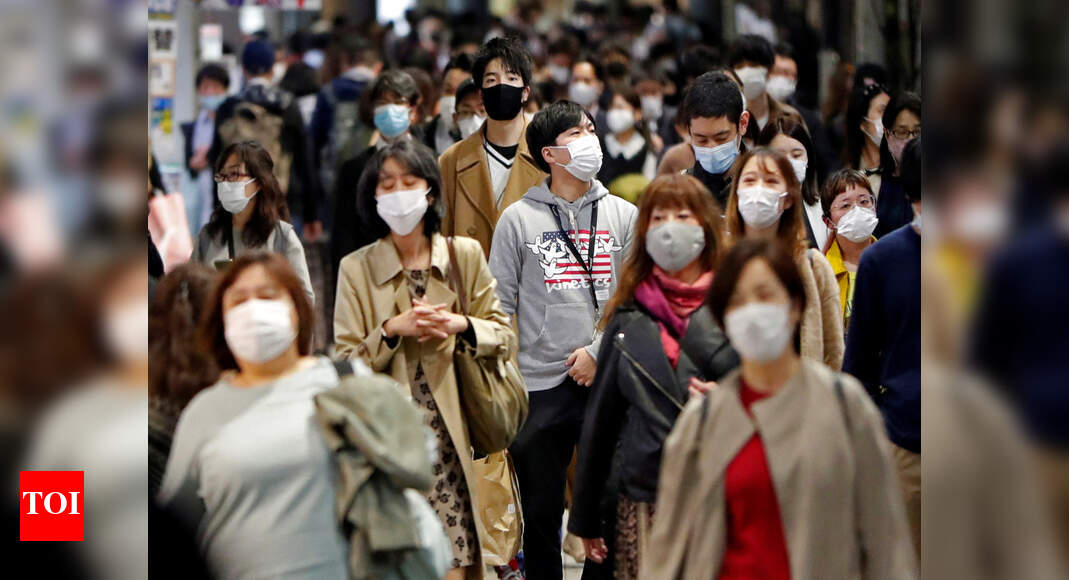 Japan records high of daily virus cases, amid worrying rise - Times of ...