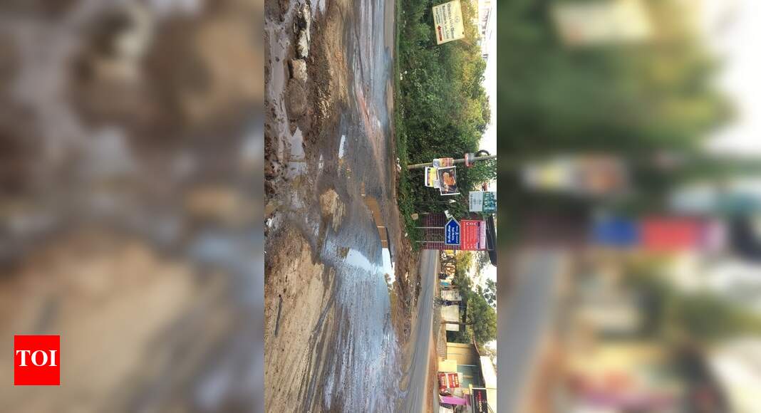 Very dangerous deep pits at road junction - Times of India