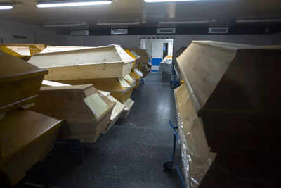 Stacks of coffins: German crematorium struggles in pandemic - Times of ...