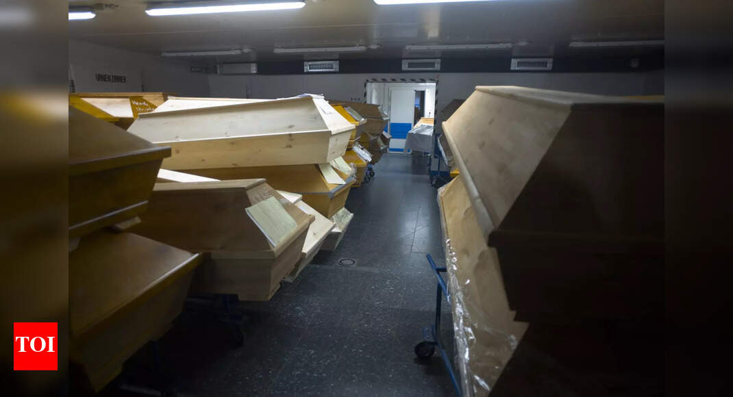 Stacks of coffins: German crematorium struggles in pandemic - Times of ...