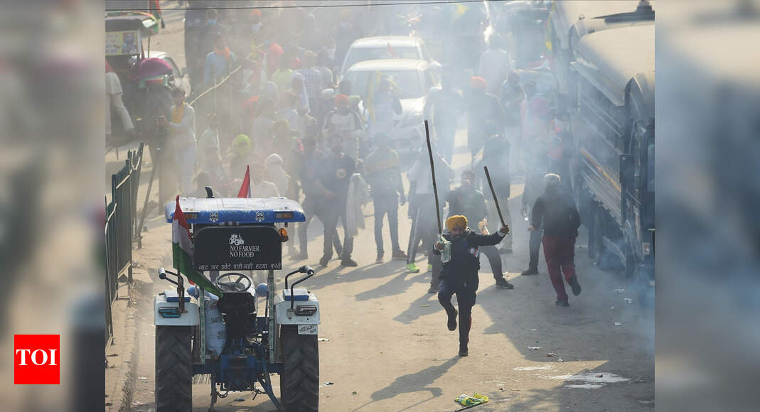 Delhi: 200 detained in connection with farmers' tractor rally violence ...