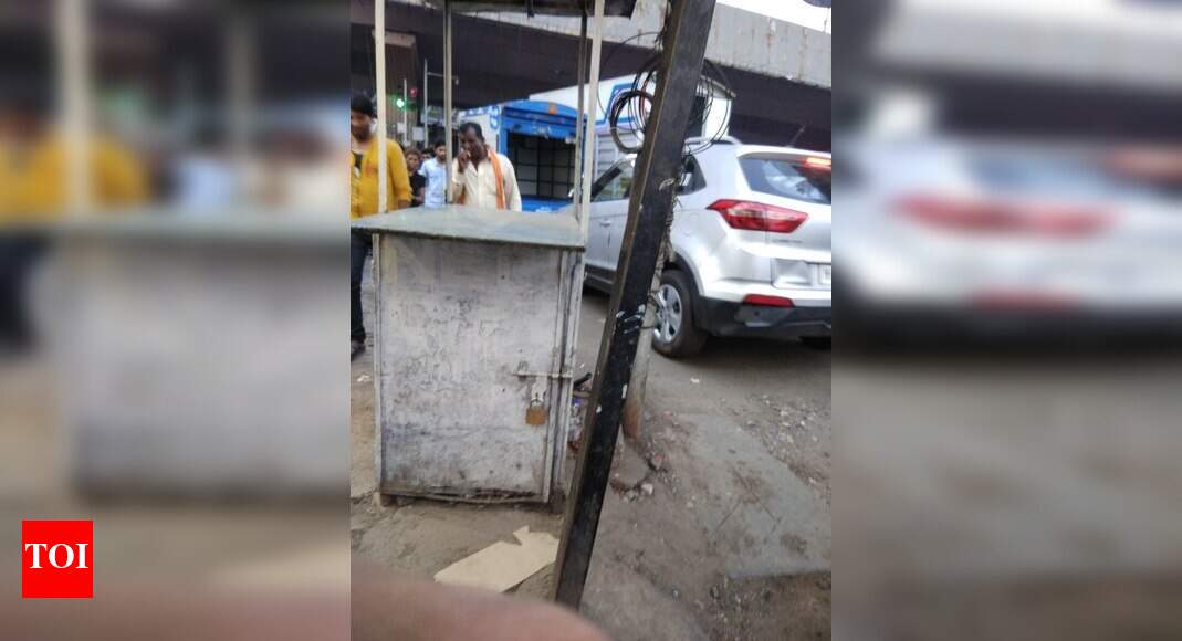 Shops on footpath - Times of India