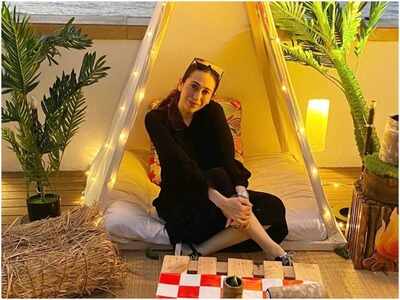 Karisma Kapoor relaxes in a tepee. Want one at your home? - Times of India