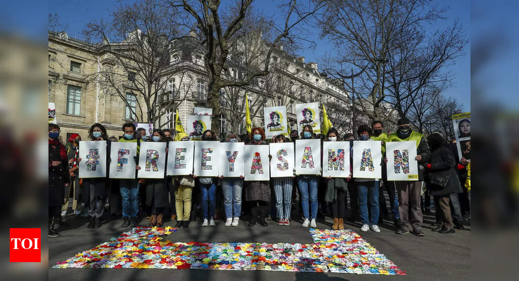 Flower protest in Paris for Iranian no-headscarf activist - Times of India