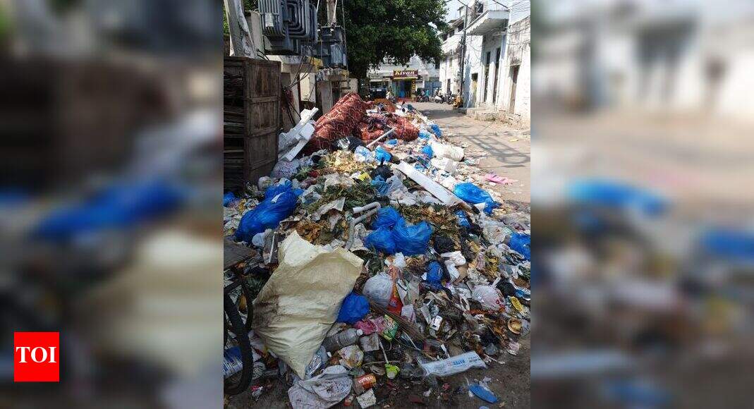 overflowing garbage since weeks - Times of India