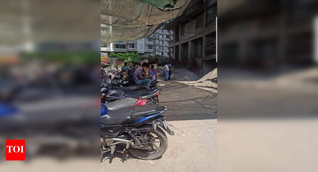 Encroachment by Builder using construction debris - Times of India