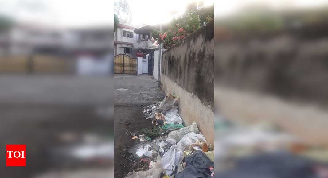 Garbage dump near houses - Times of India