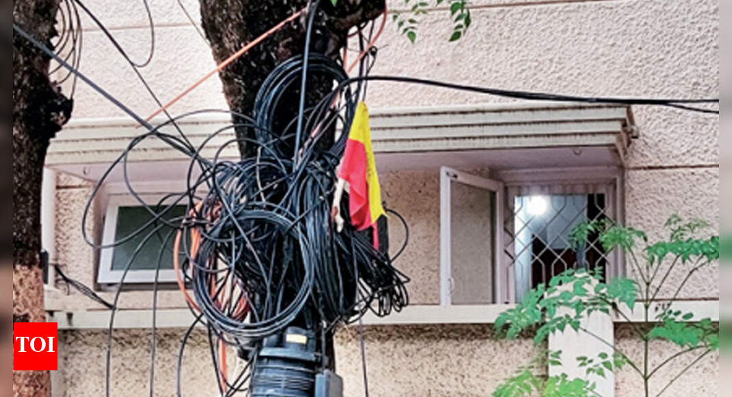 Bengaluru: Residents fume as dangling cables, wires on pavements pose ...