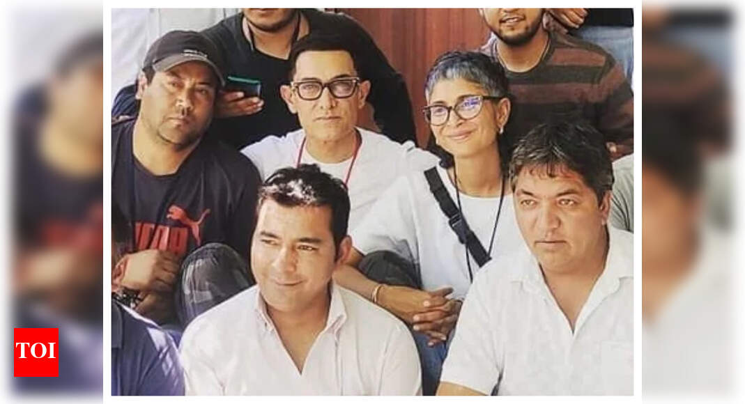 Aamir Khan and Kiran Rao pose with a group of people in Kargil on sets of 'Laal Singh Chaddha ...