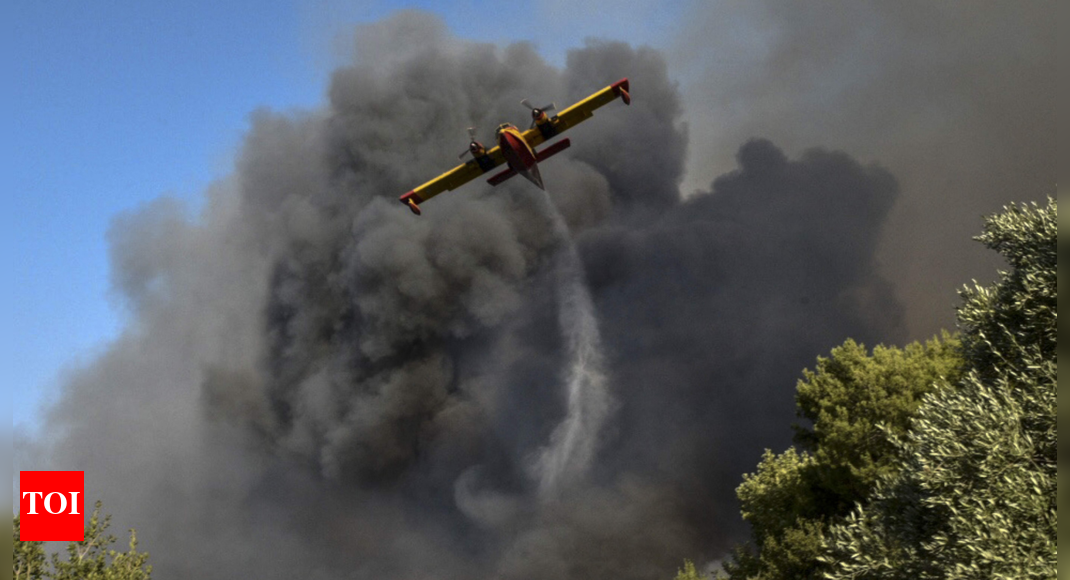 Firefighting planes resume flights over fire north of Athens - Times of ...