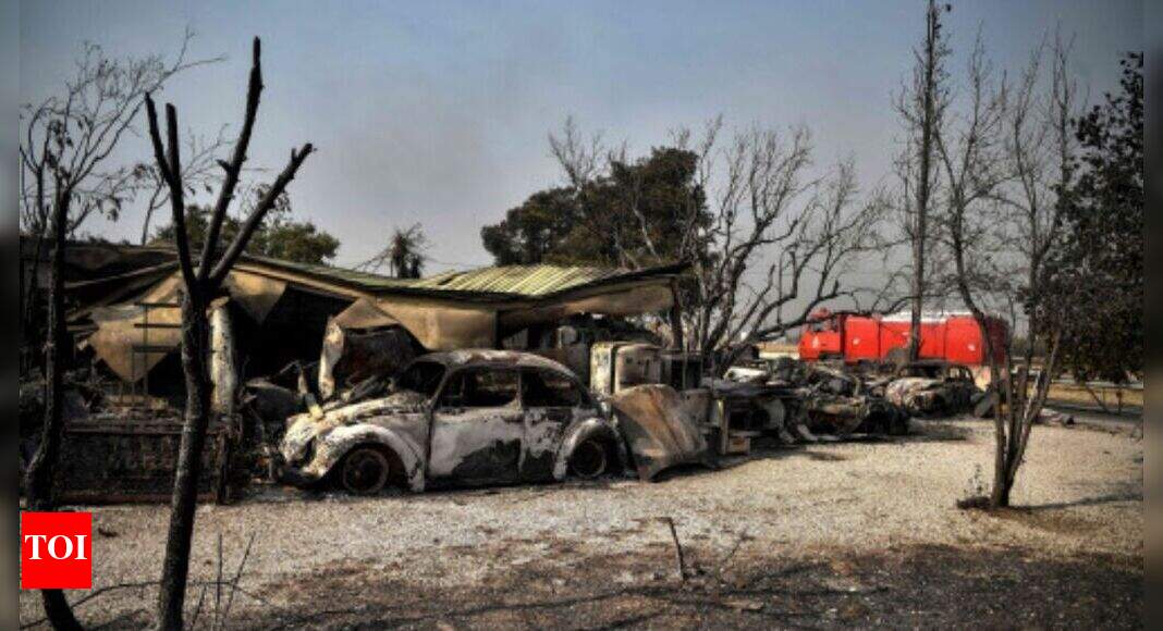 Crews race to contain fire near Athens after thousands flee - Times of ...