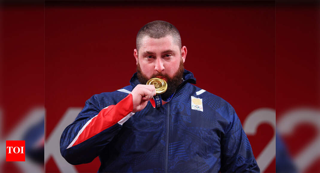 Tokyo Olympics: Georgia's weightlifter Talakhadze breaks world record ...