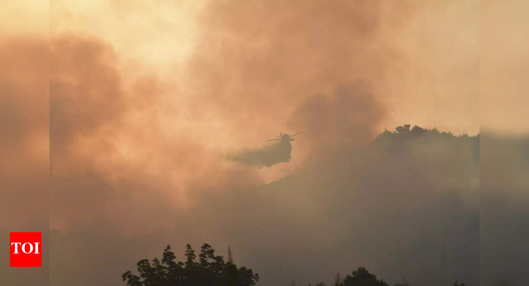 Greece battles to control fire close to ancient Olympic site - Times of ...