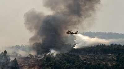 Fire rages anew near Athens, evacuations in southern Greece - Times of ...