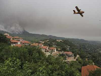 Fire rages anew near Athens, evacuations in southern Greece - Times of ...