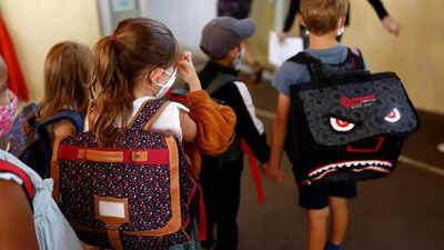 Facemasks and sanitizer as French kids go back to school - Times of India
