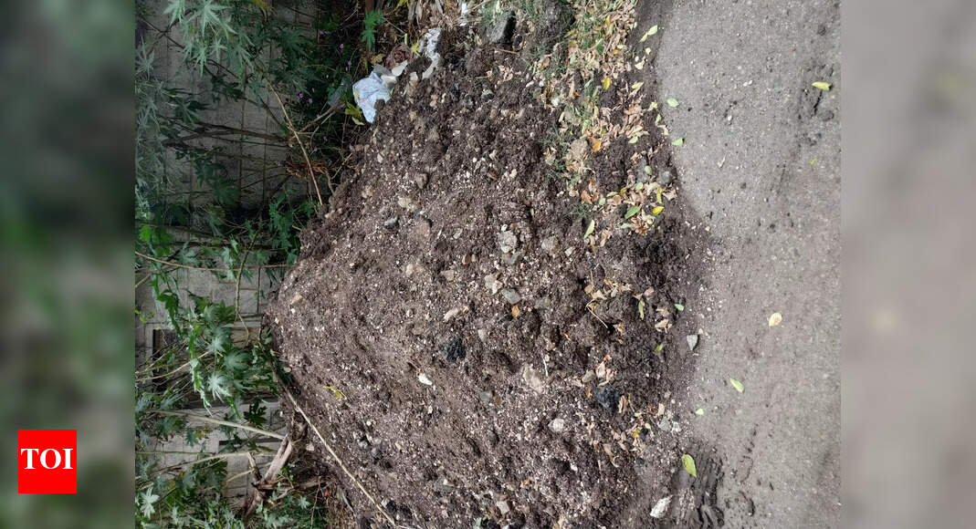 MUD PILED UP NEAR DRAIN OUTLET - Times of India