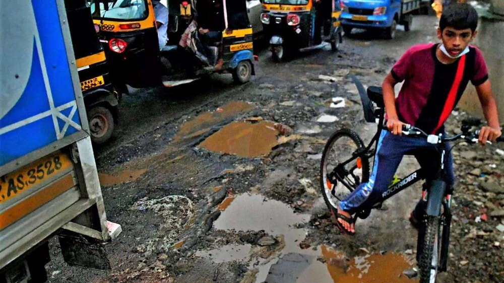 In photos: Potholes scar roads in Mumbai, Thane | The Times of India