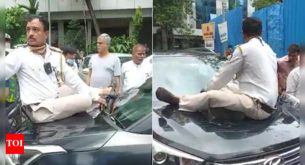 Mumbai: Motorist drives off with cop seated on vehicle bonnet, video ...