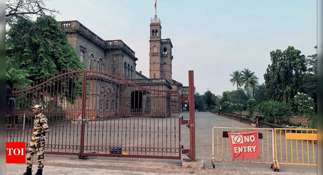 Gates blocking Savitribai Phule Pune University main building draw ...